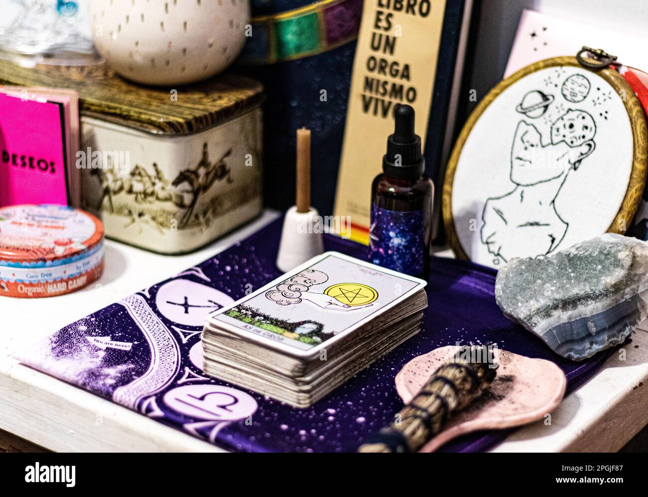 A pack of tarot cards with other unique items on the shelf Stock Photo ...