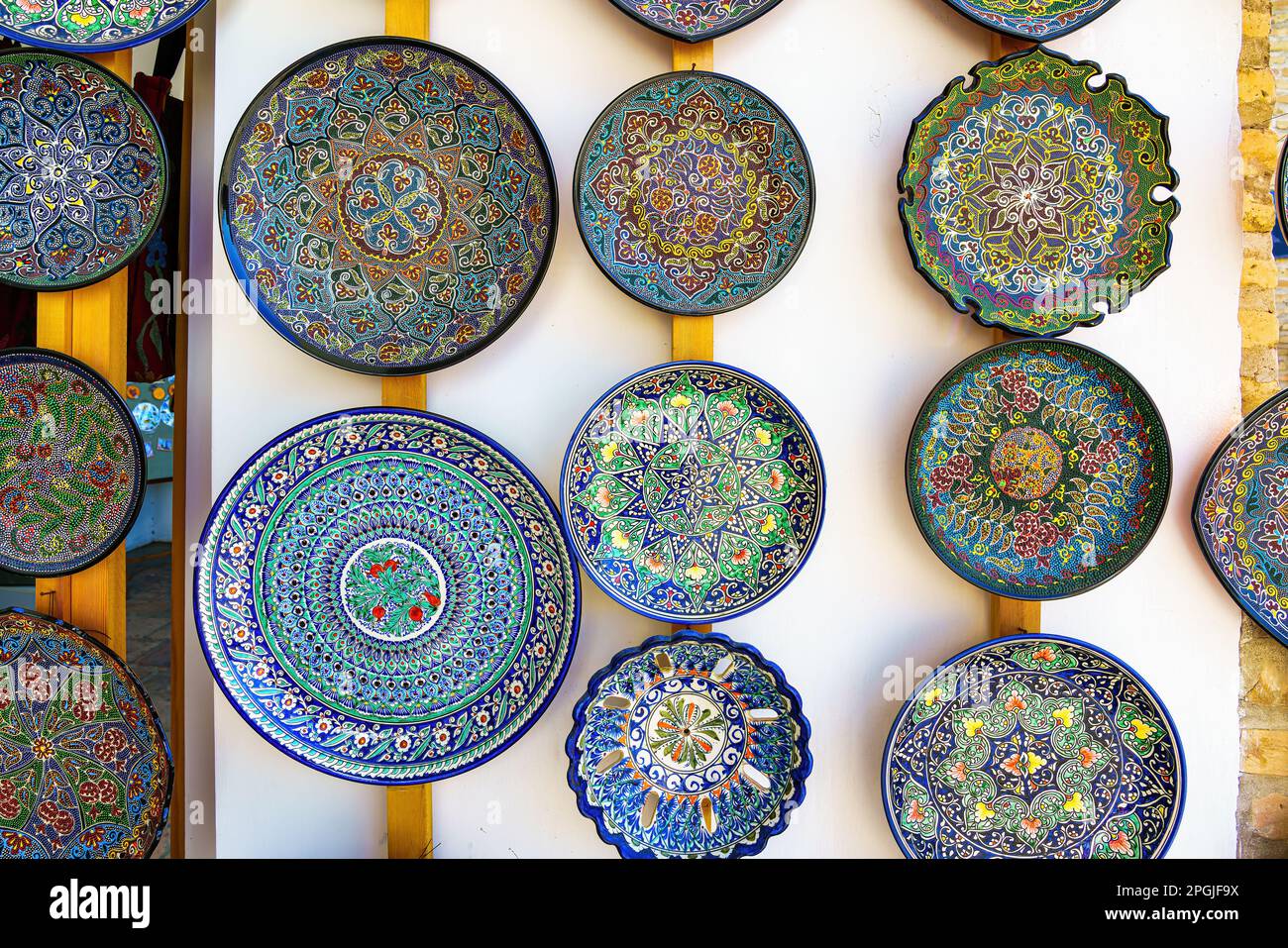 Arabic painted ceramic plates hanging on the wall Stock Photo - Alamy