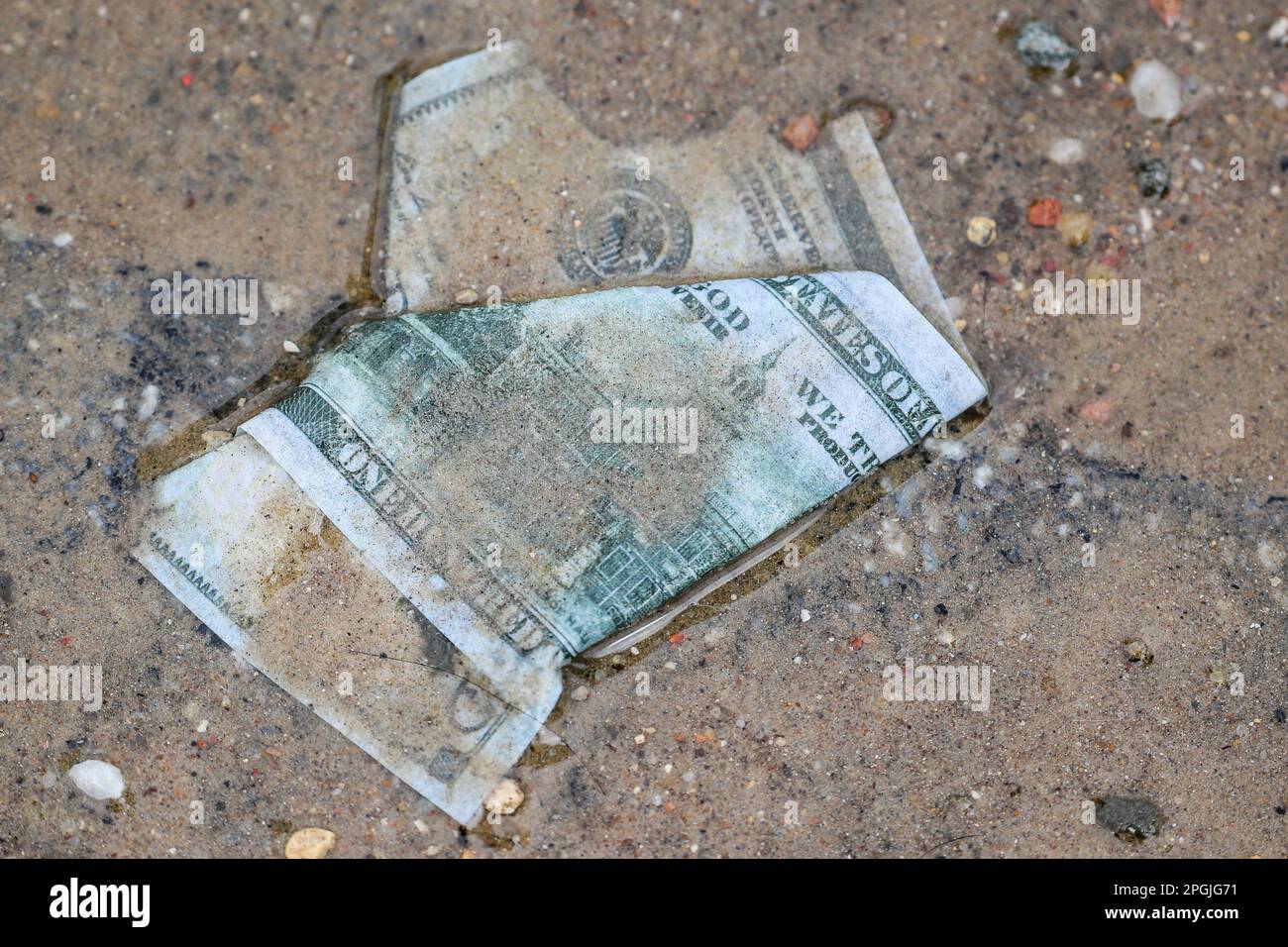 A crumpled $100 bill on the ground Stock Photo - Alamy