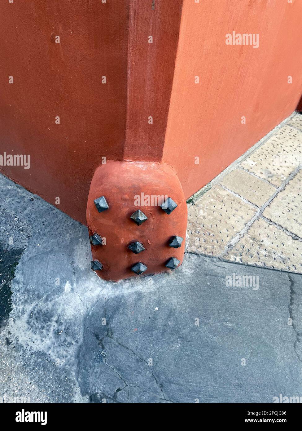 A guard stone at the corner of a building in the historical center of ...