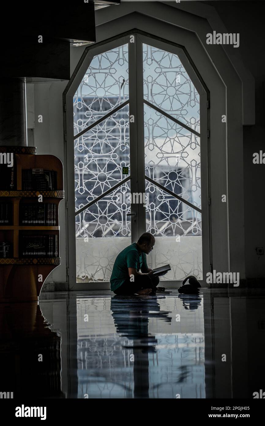 Makassar, South Sulawesi, Indonesia. 23rd Mar, 2023. A man is sitting ...
