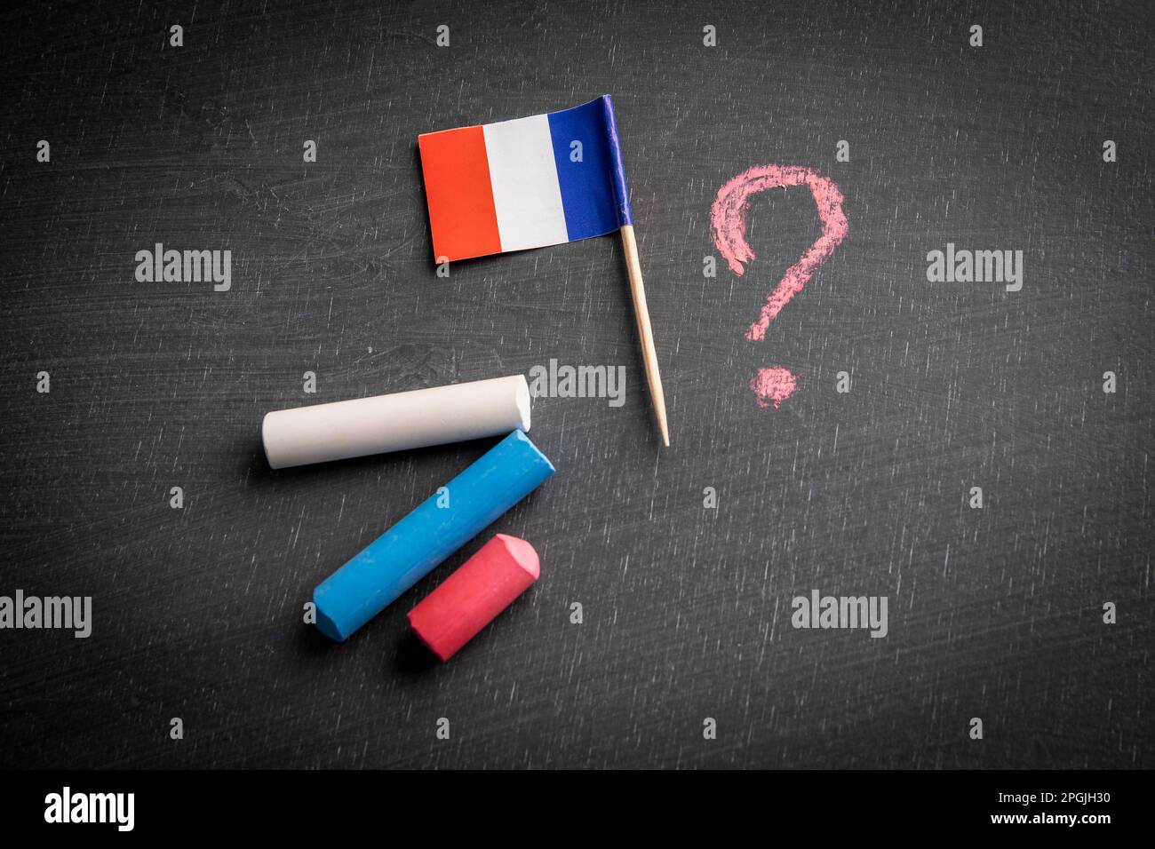 French flag on dark chalkboard background. Business, politics, travel ...