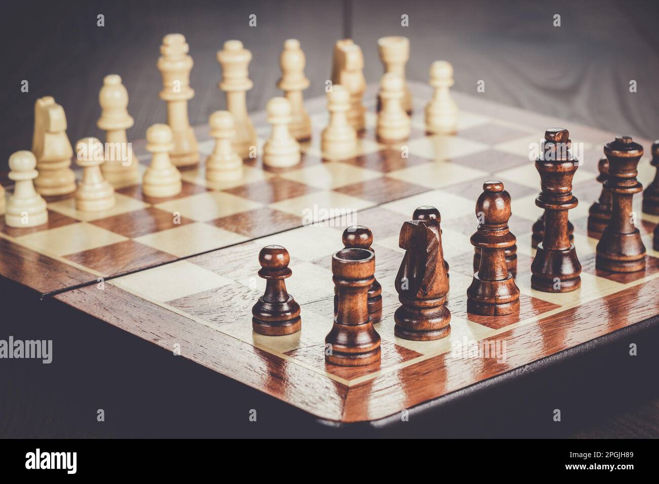 chess board with figures on the wooden table background Stock Photo - Alamy