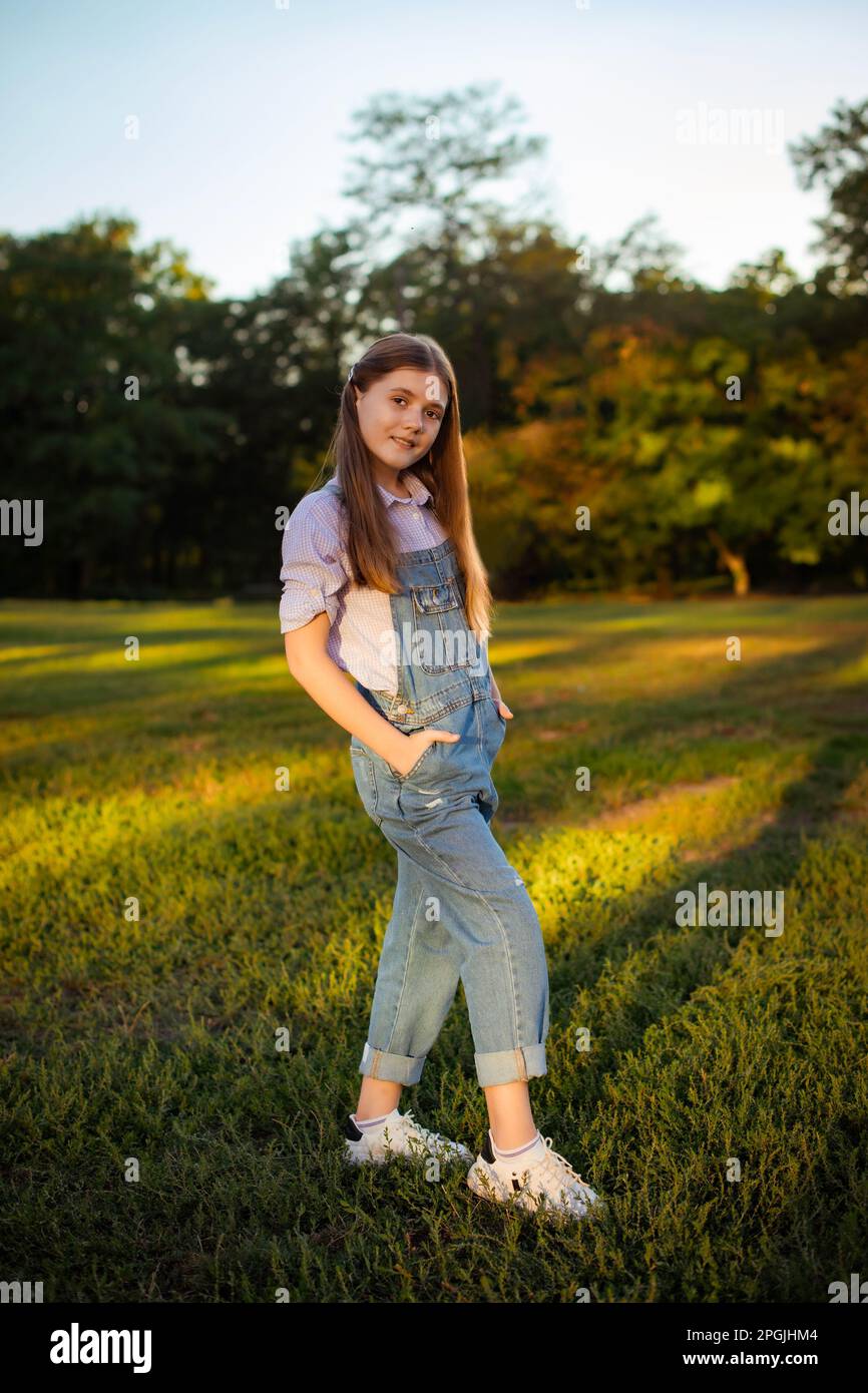 Happy girl relaxing on active outdoor activity. school girl walking ...