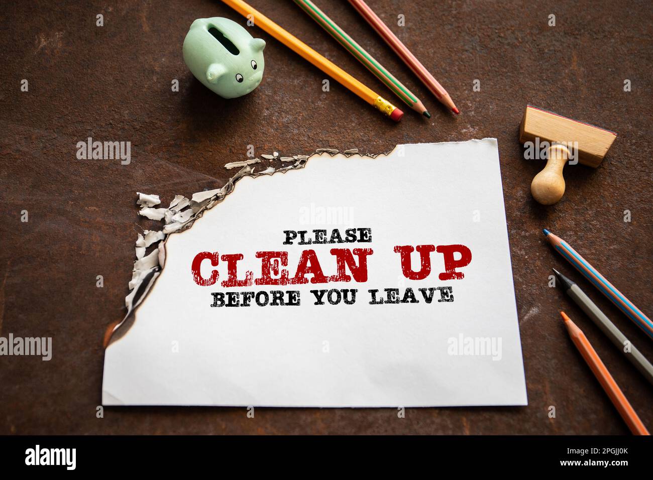 Please clean up before you leave. Burning sheet of paper on a rusting ...