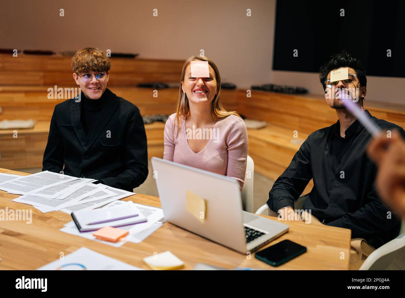 Cheerful business team at corporate training, team building activity ...