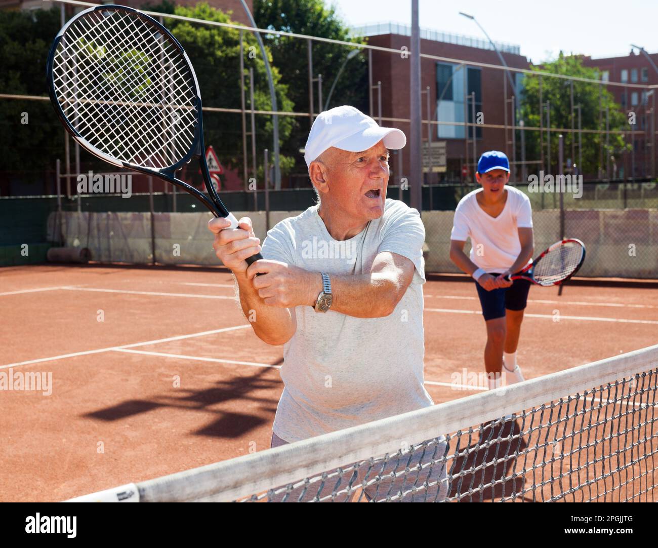 tennis players of different generations playing tennis court Stock ...