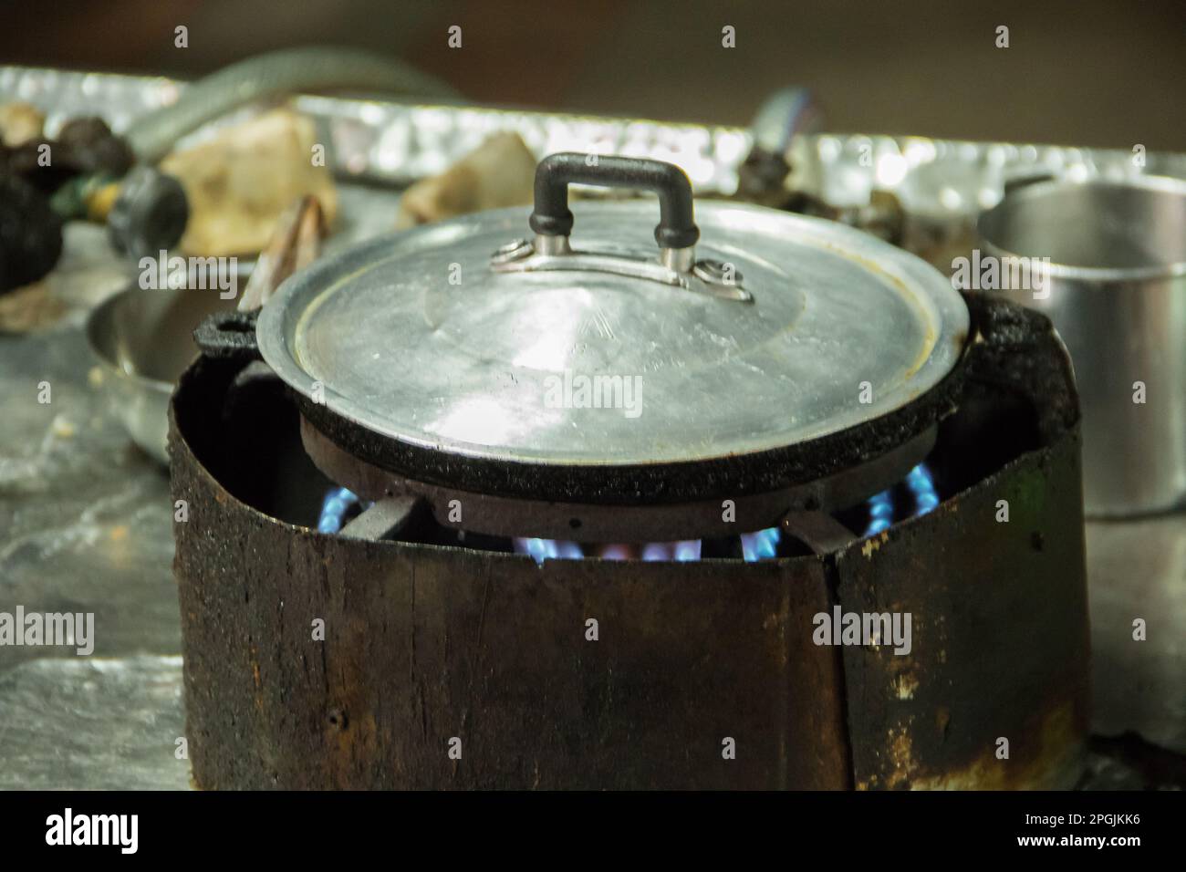 Roti in a deep frying pan, sprinkled with granulated sugar and ...