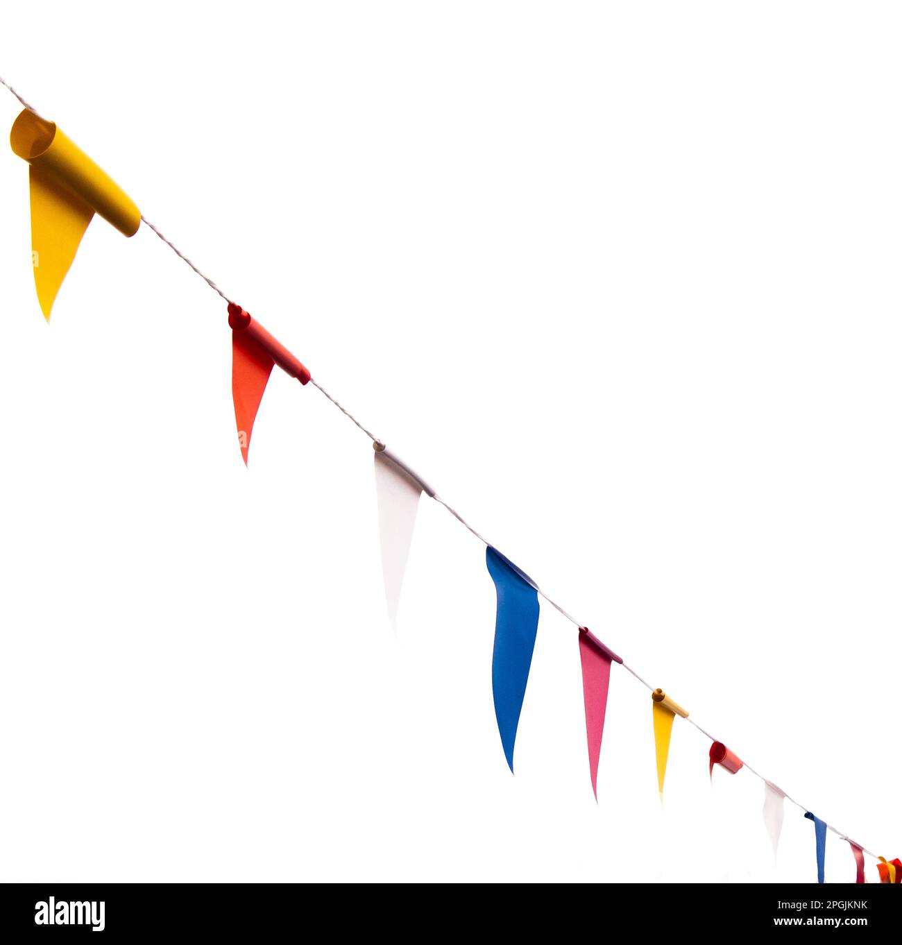 A string of red, white and blue bunting flags against a summer sky at a ...