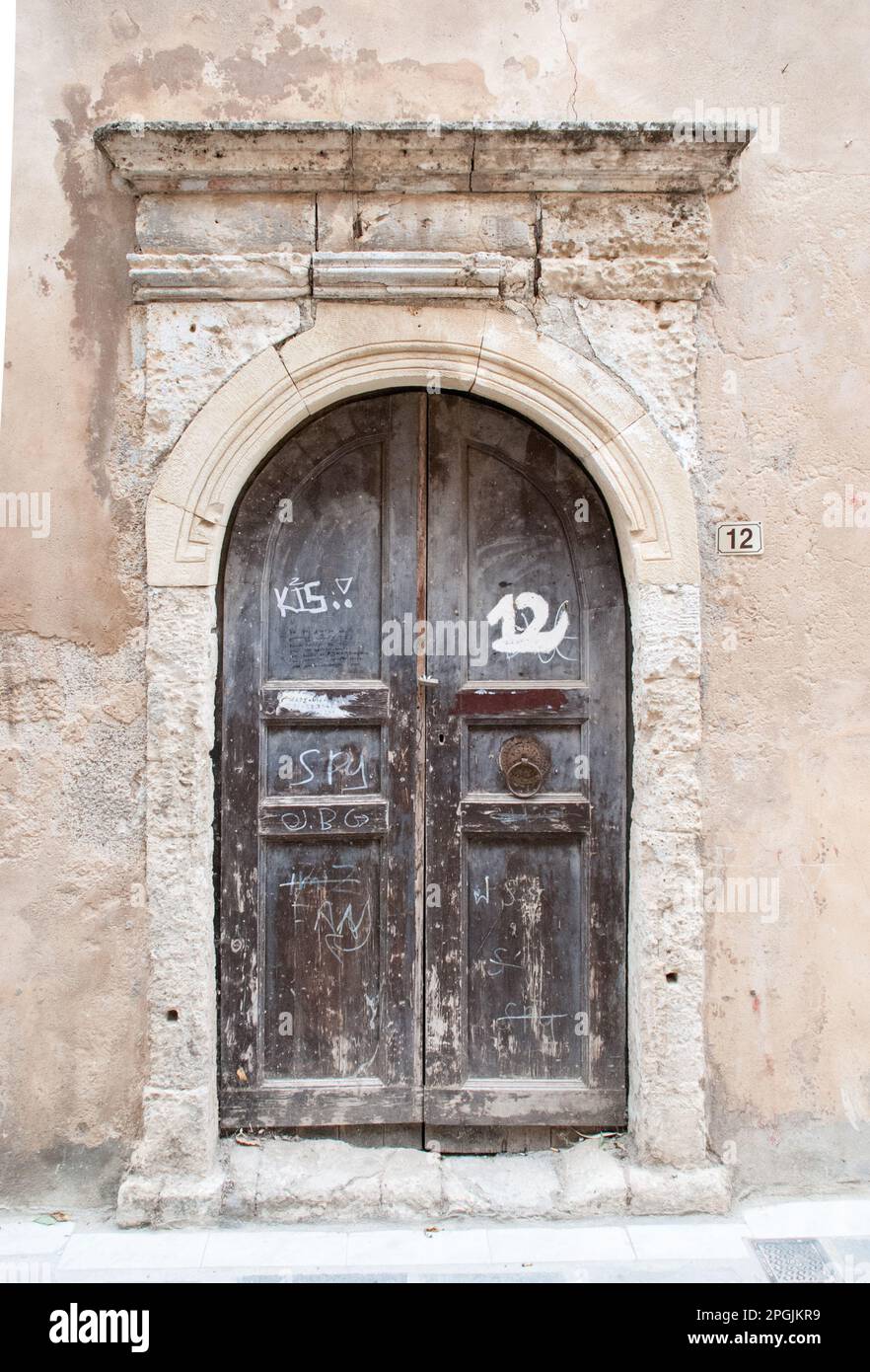 Old weathered doors,& stone arches to be seen in Crete when wandering ...
