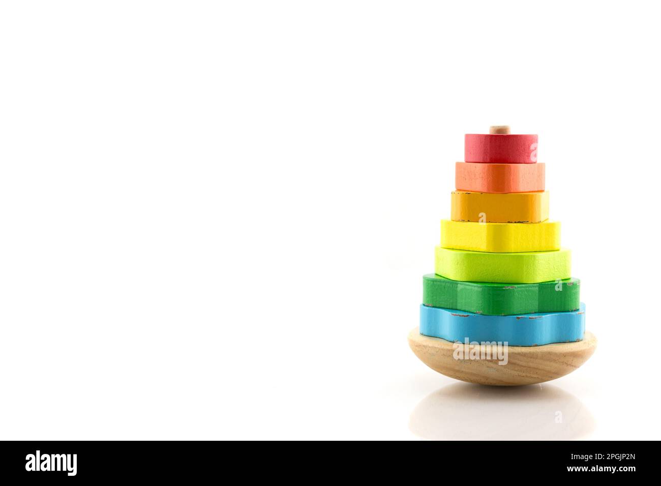 Pyramid build from colored wooden rings. Toy for babies and toddlers to ...