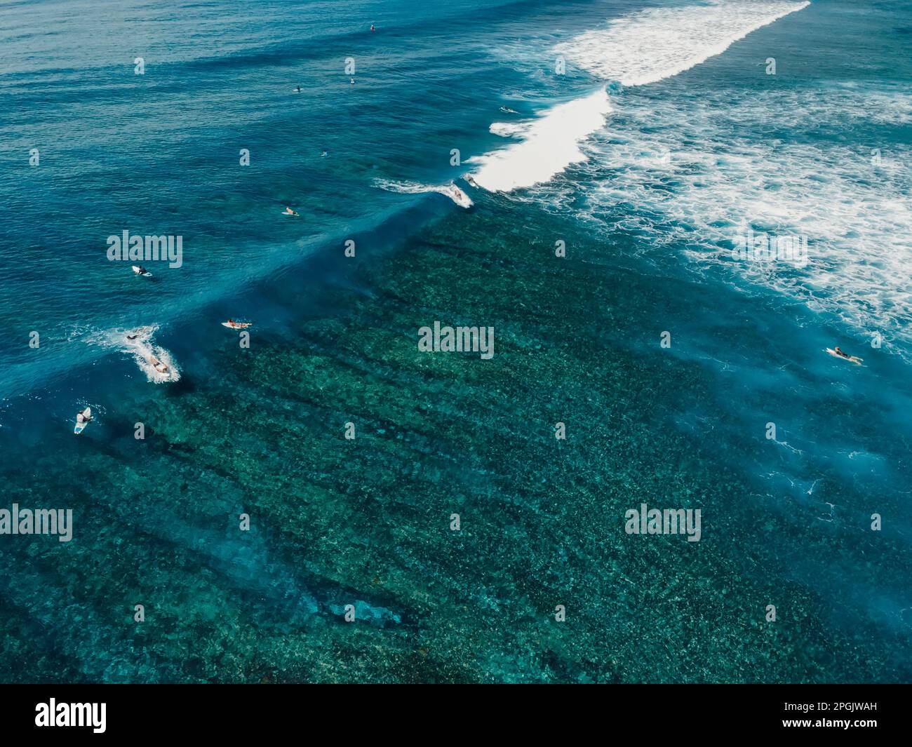 Aerial view with surfing on glassy wave. Perfect waves with surfers in ...