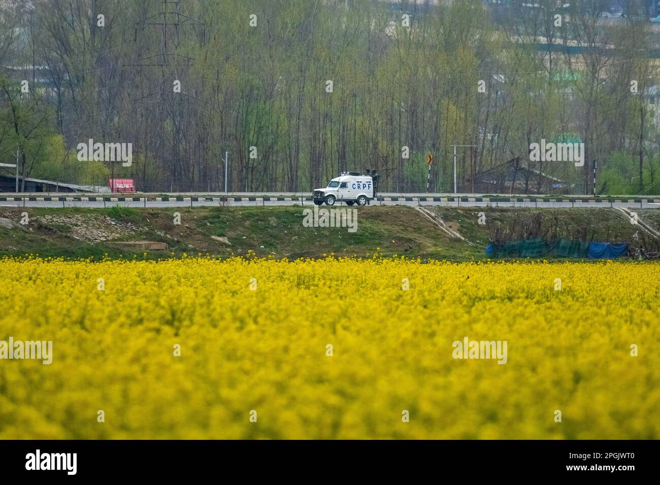 Indian army vehicle patrols on Kashmir's main highway alongside a ...