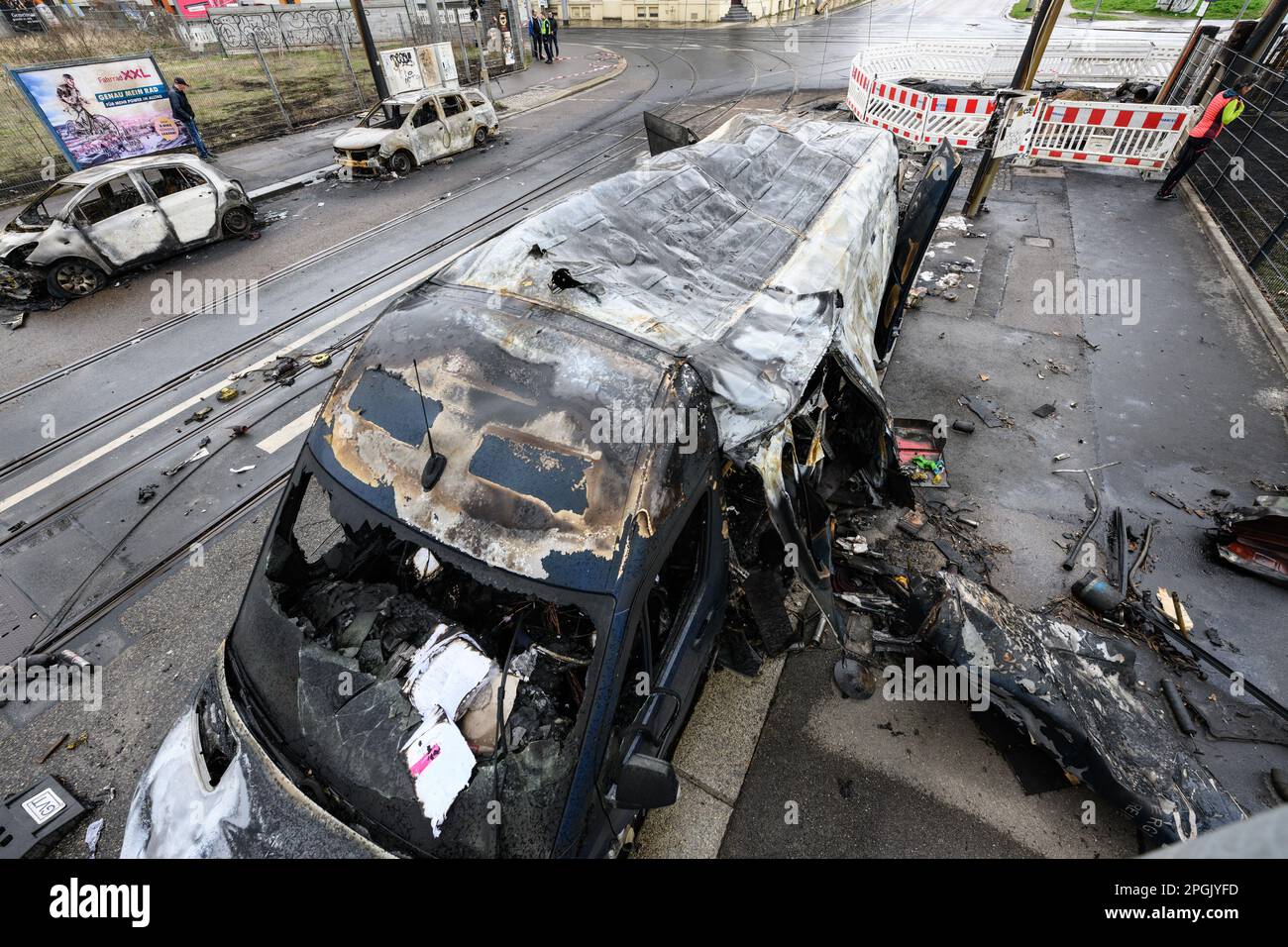 Dresden, Germany. 23rd Mar, 2023. Burnt-out cars stand on the side of ...