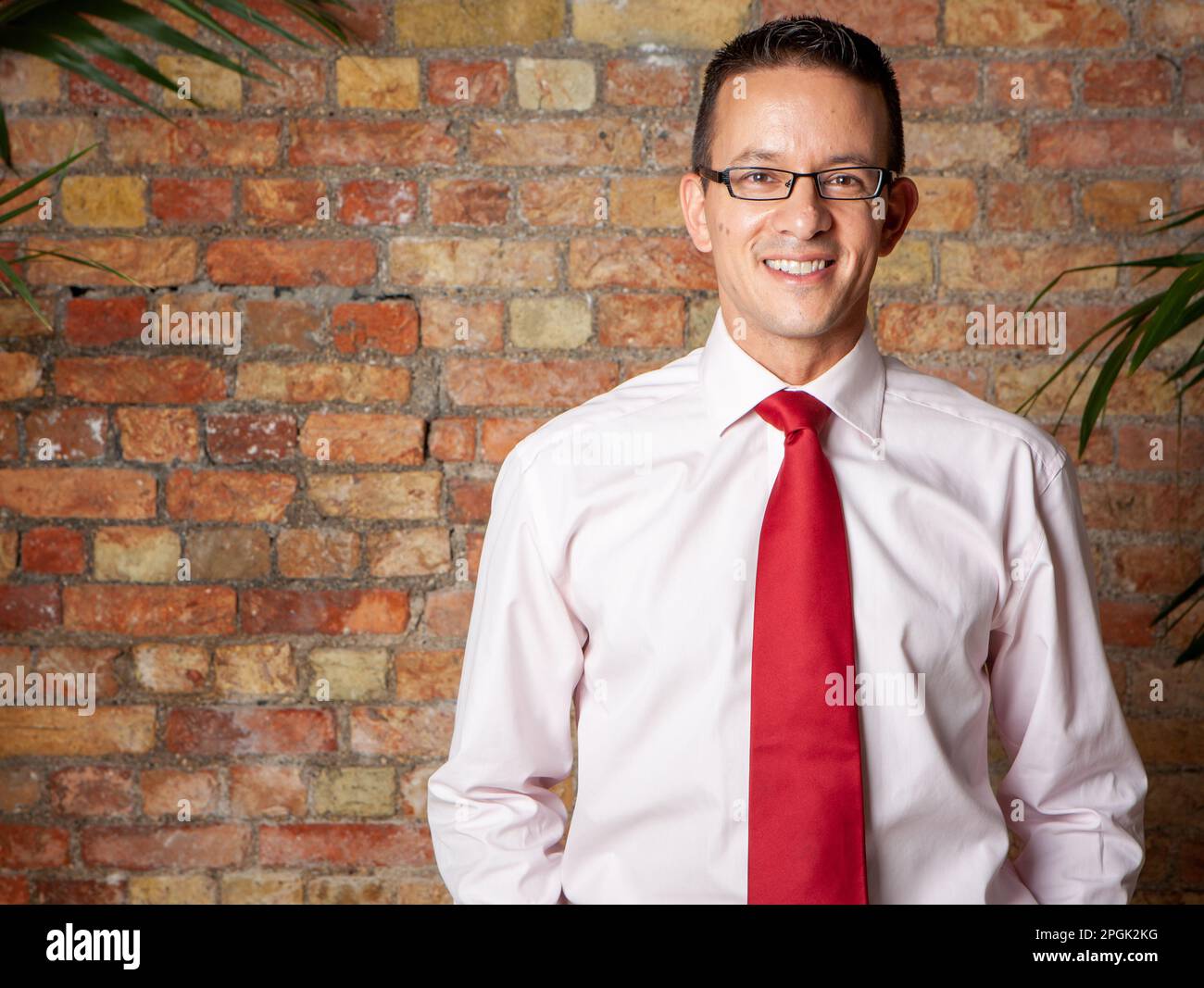 Smart Portrait. A relaxed and friendly portrait from a smiling man in a ...