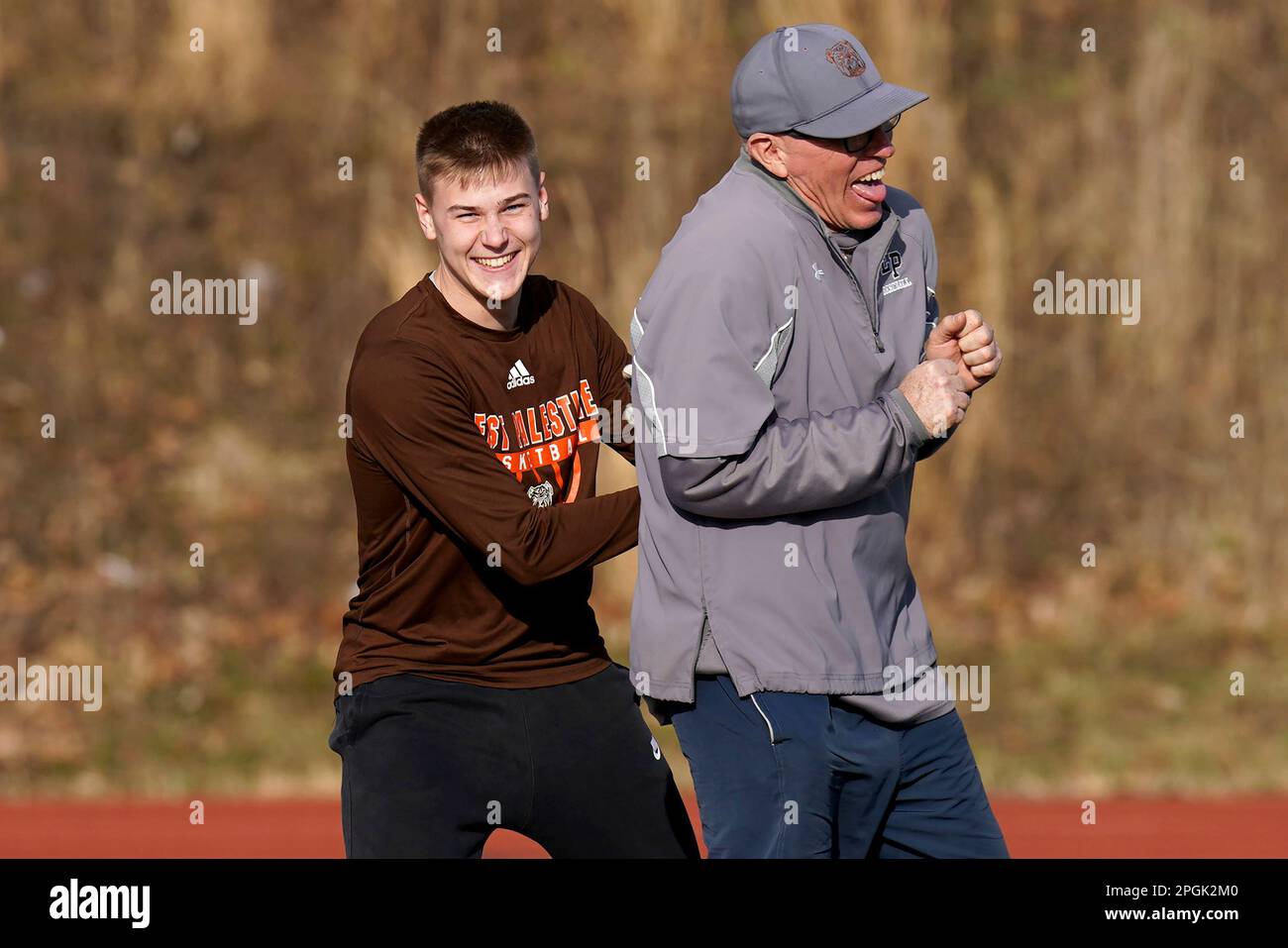East Palestine High School senior Owen Elliott reaches head coach Bill ...