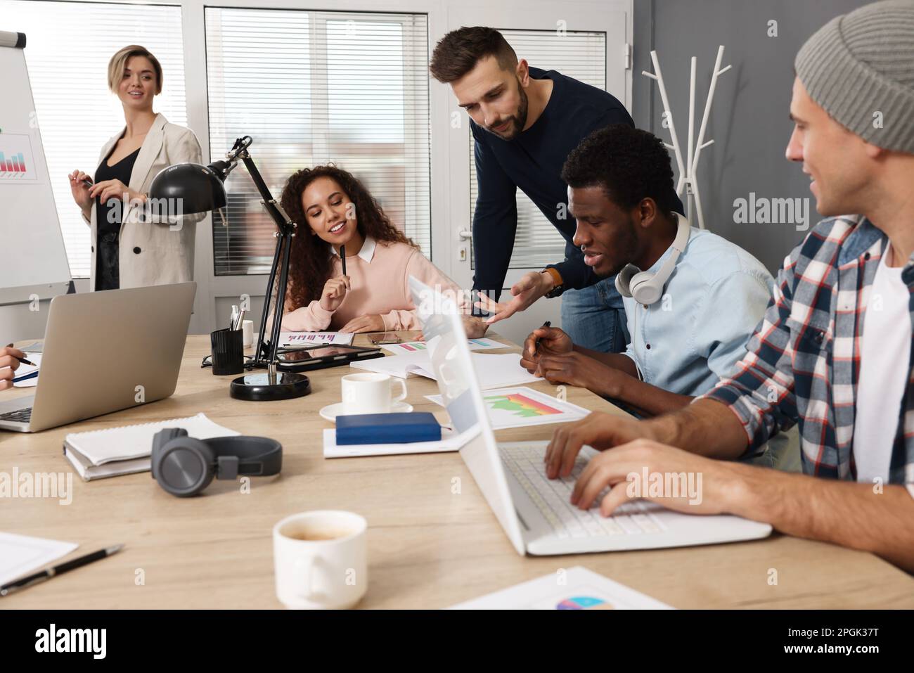 Team of employees working together in office. Startup project Stock ...