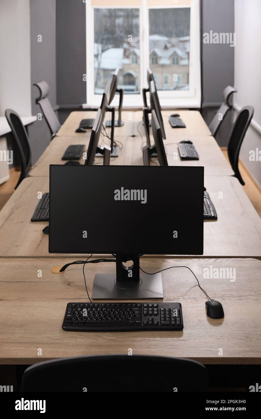 Many modern computers in open space office Stock Photo - Alamy