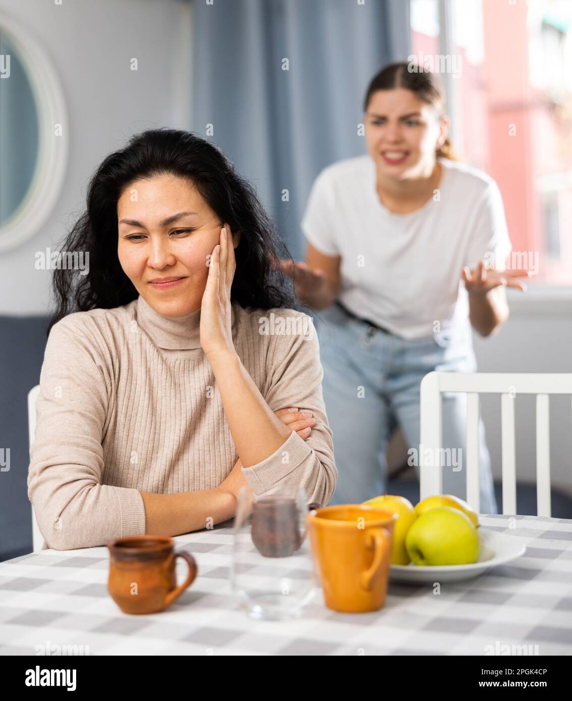 Outraged girl yells at her friend during domestic quarrel Stock Photo ...
