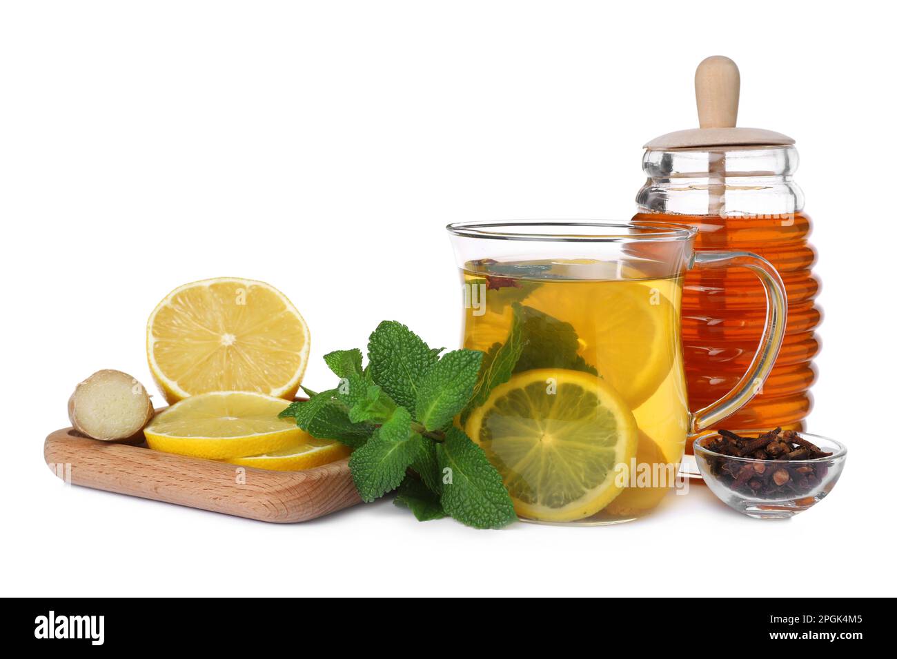 Glass cup of immunity boosting drink and ingredients on white ...