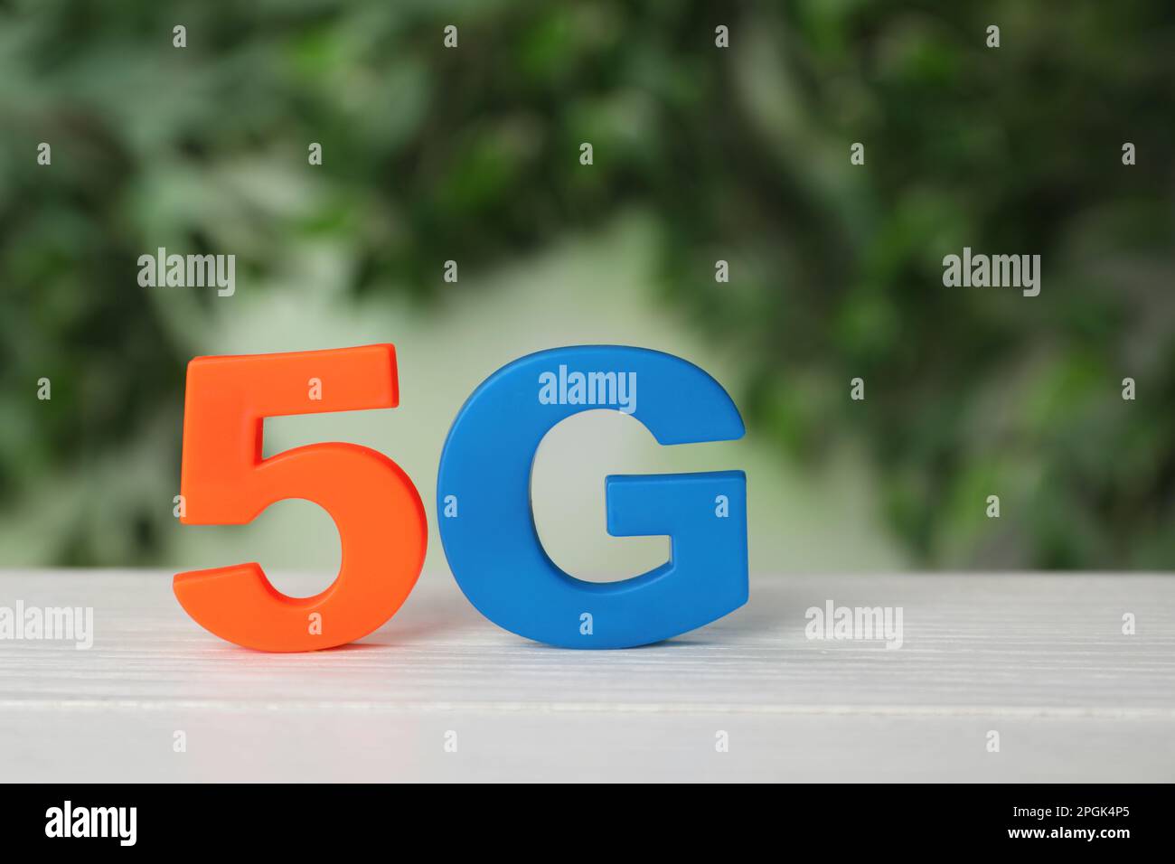 5G technology, Internet concept. Number and letter on white wooden ...