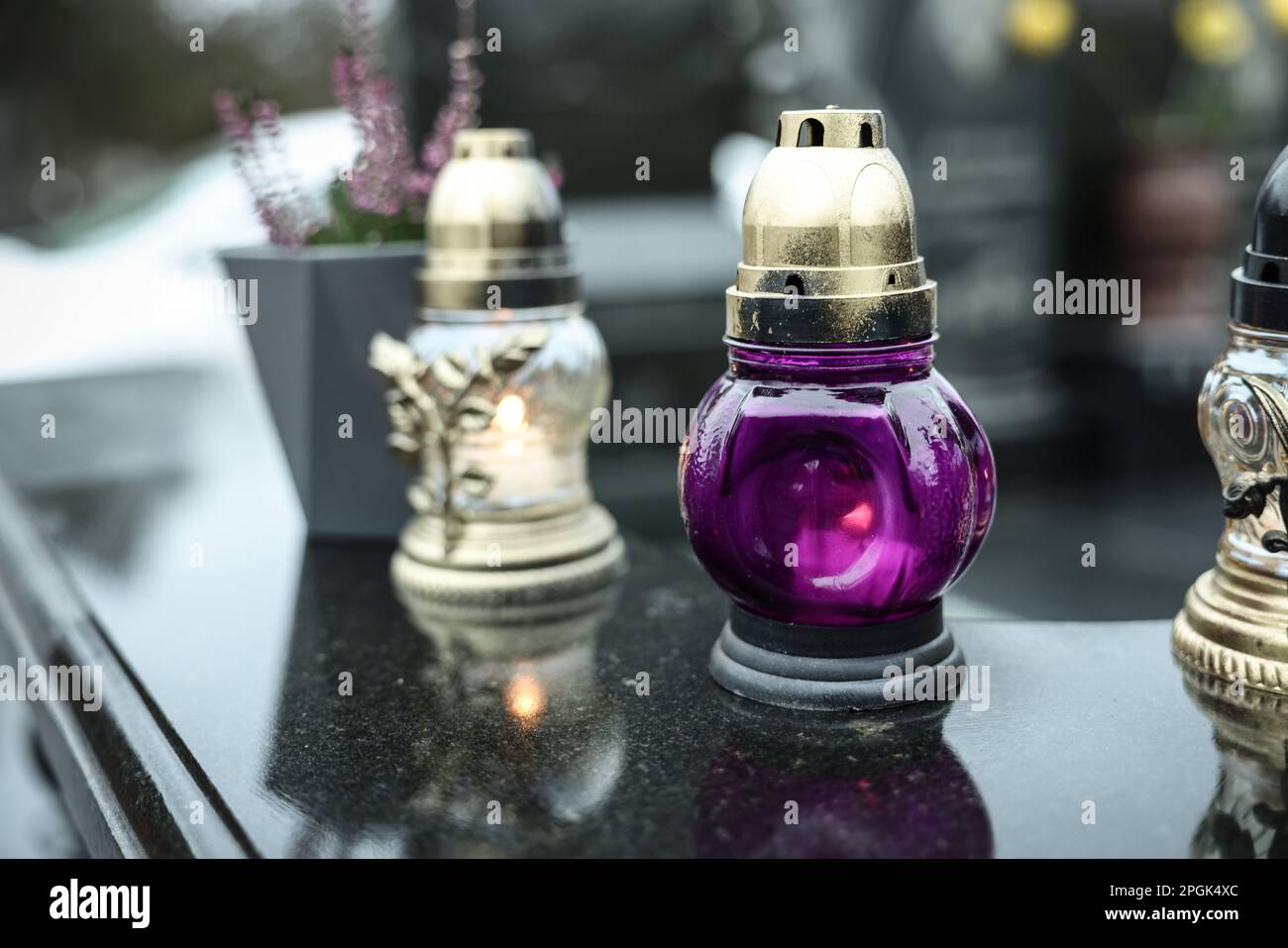Grave lights on granite surface at cemetery Stock Photo - Alamy