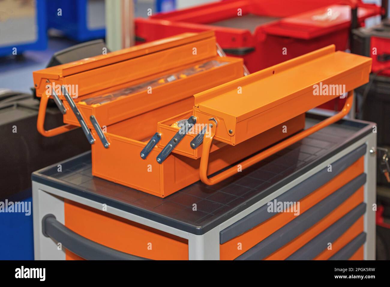 Orange Metal Cantilever Tool Box Flip Out in Workshop Stock Photo - Alamy