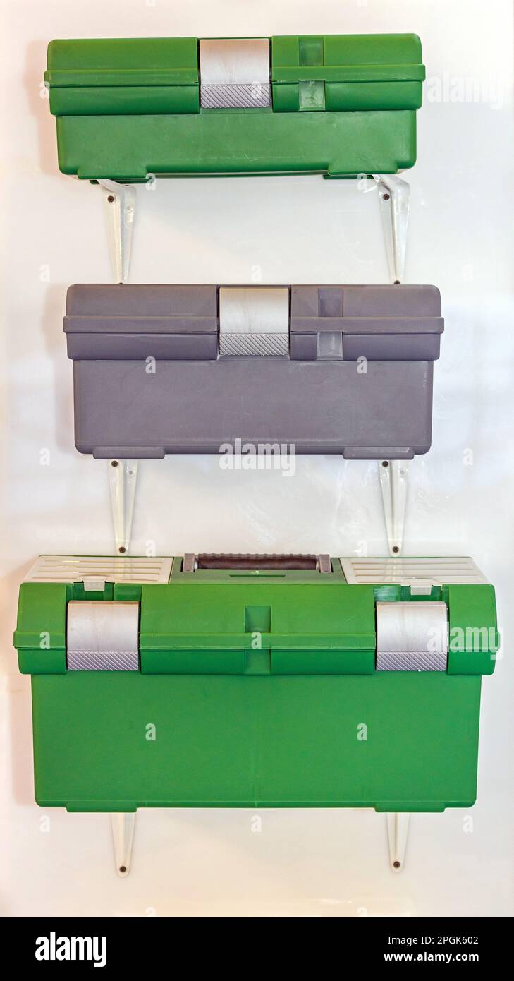Three Size Plastic Tool Boxes at Wall Shelf Stock Photo - Alamy