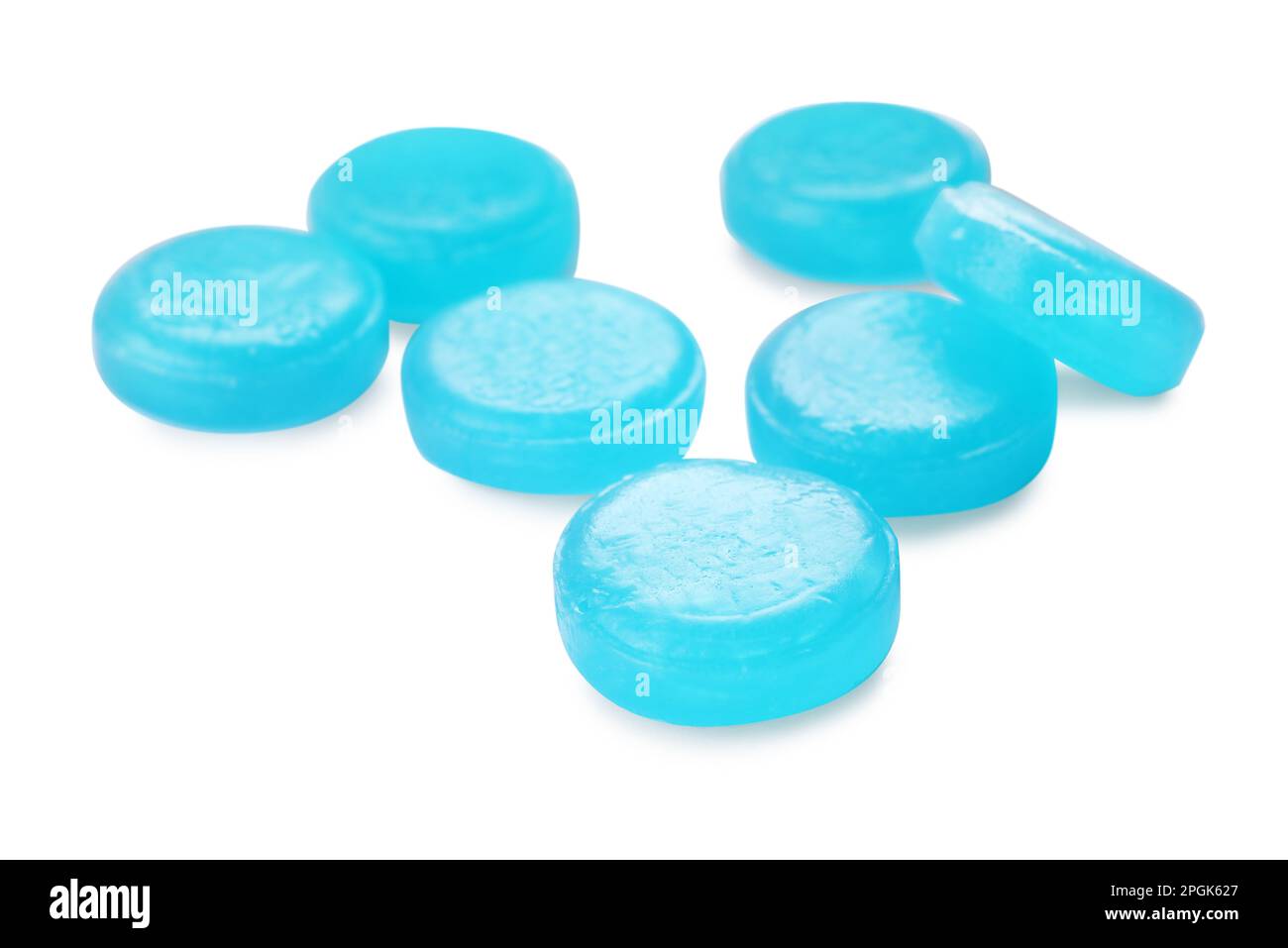 Many light blue cough drops on white background Stock Photo - Alamy