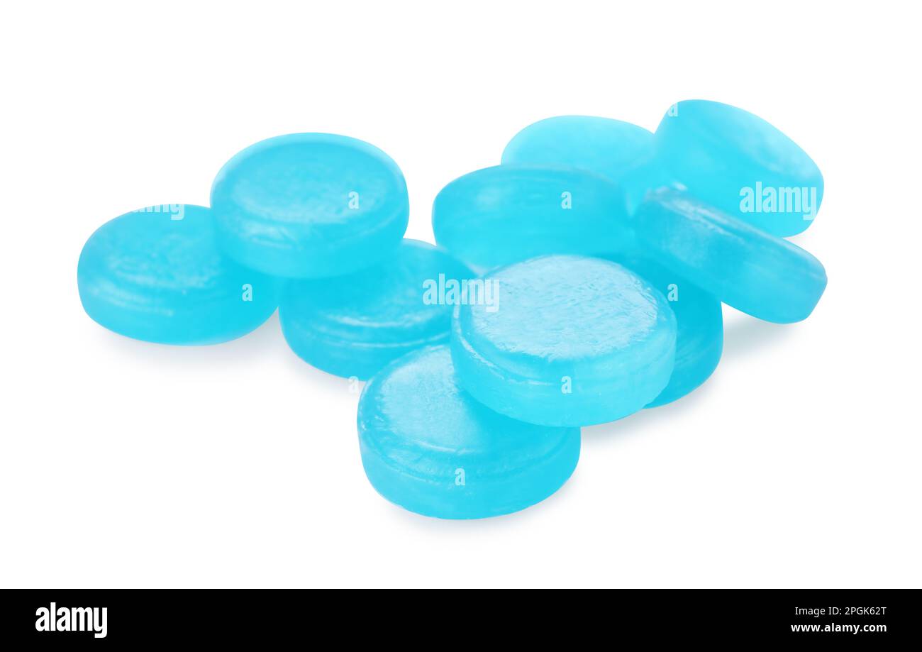 Many light blue cough drops on white background Stock Photo - Alamy