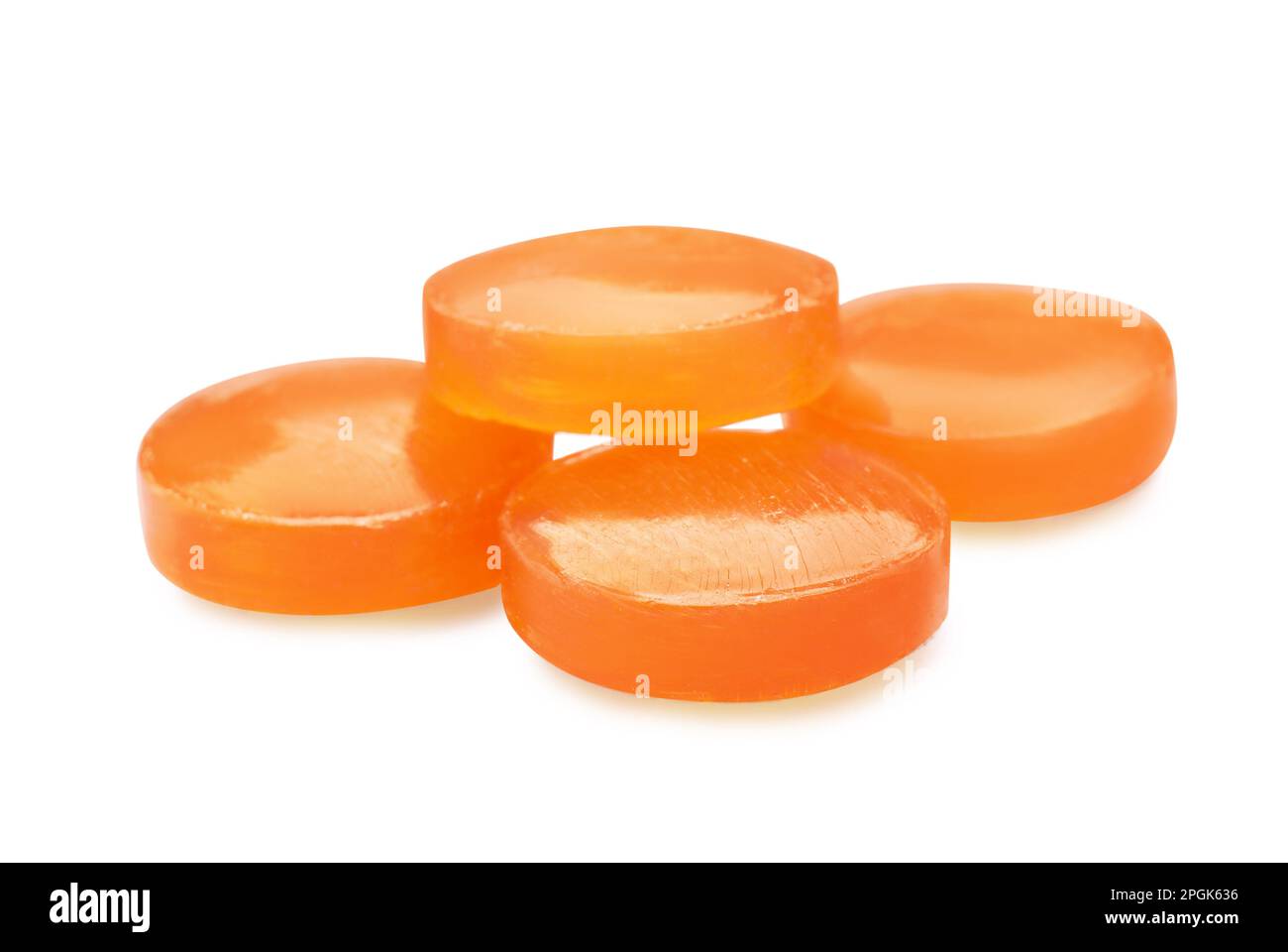 Orange cough drops on white background. Pharmaceutical product Stock ...