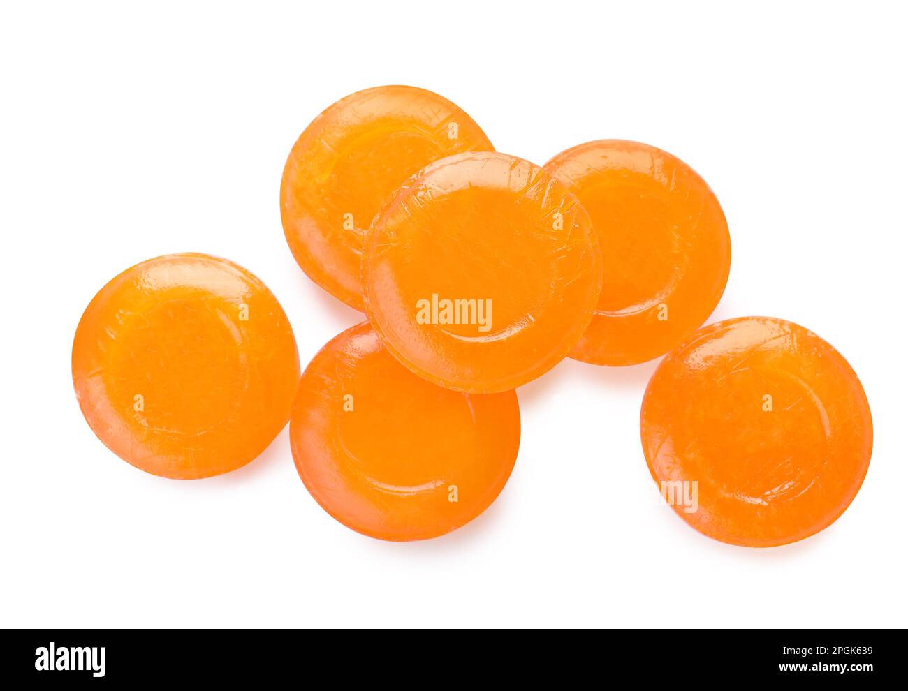 Many orange cough drops on white background, top view Stock Photo - Alamy