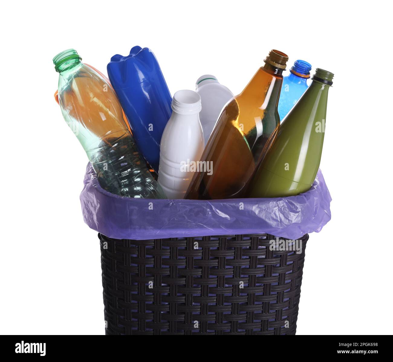 Trash bin full of plastic bottles on white background, closeup ...