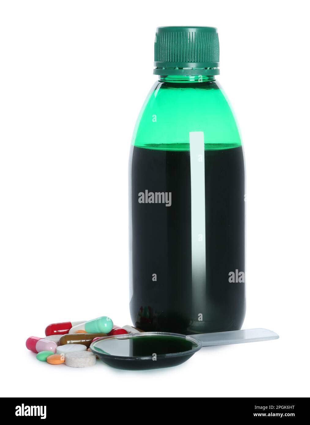 Bottle of cough syrup, dosing spoon and pills on white background Stock ...