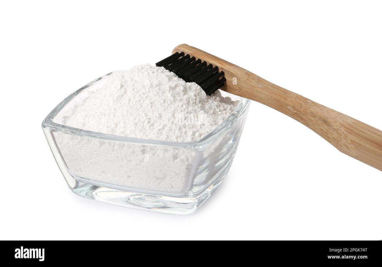 Glass bowl of tooth powder and brush on white background Stock Photo ...