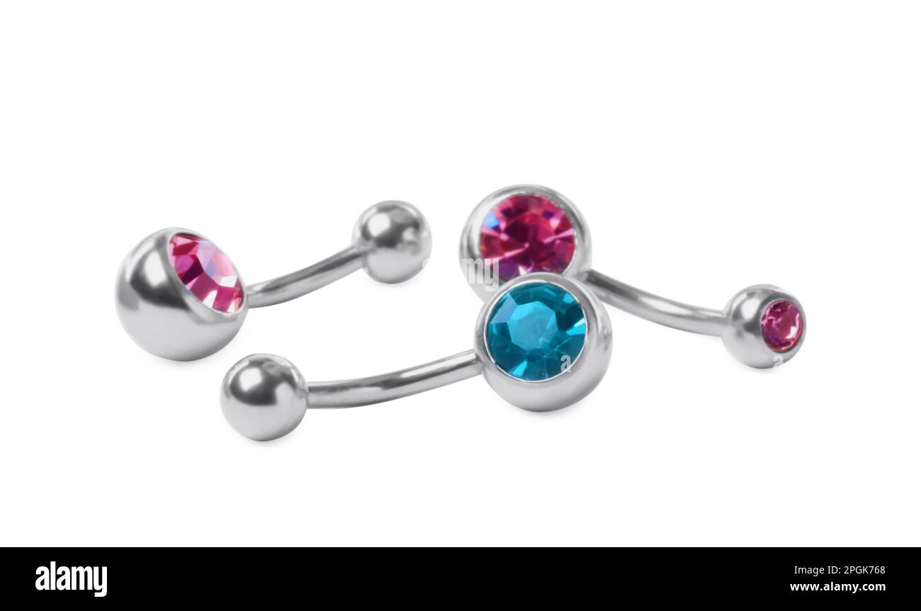 Piercing jewelry. Different belly button rings on white background ...