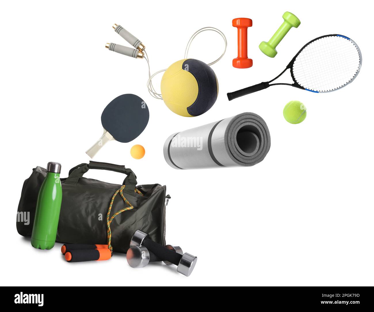Sports bag and different gym stuff flying on white background Stock ...