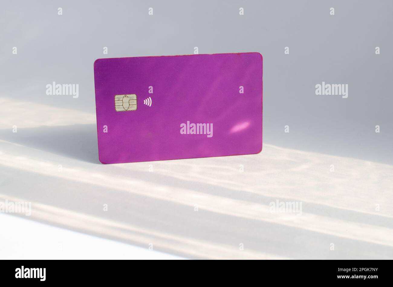 A closeup of a purple credit card isolated on an empty surface Stock ...