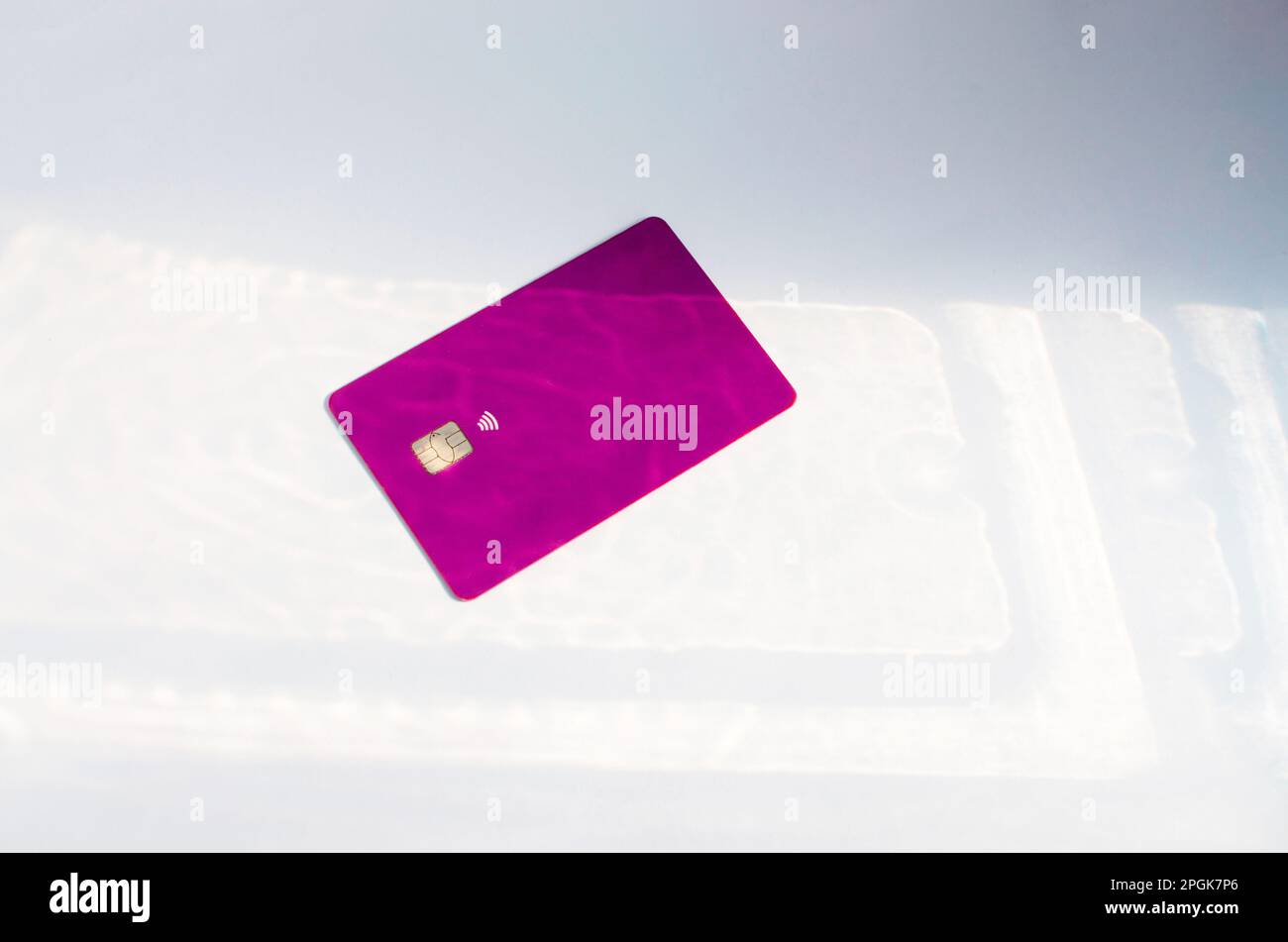 A closeup of a purple credit card isolated on an empty surface Stock ...