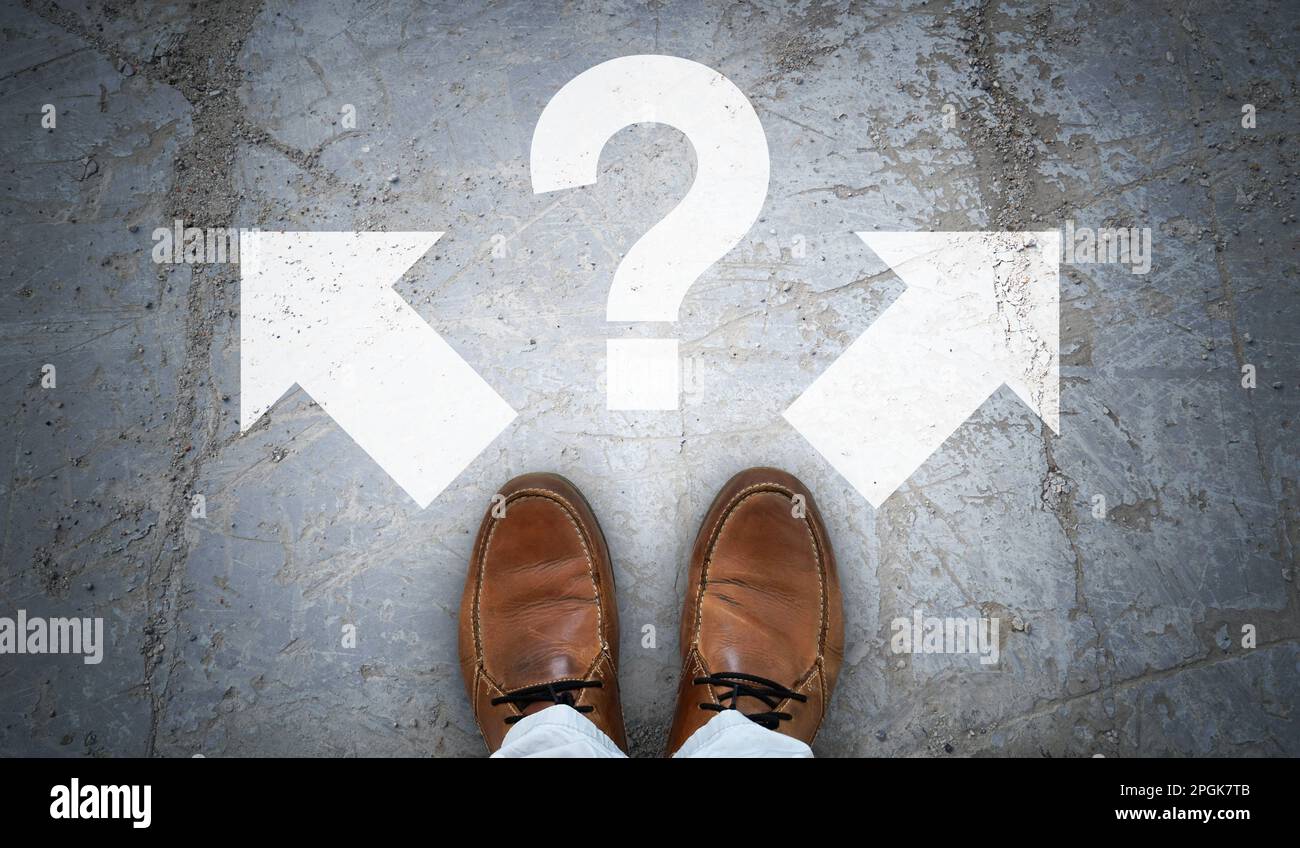 Brown leather shoes, two arrows and question mark - problem concept ...