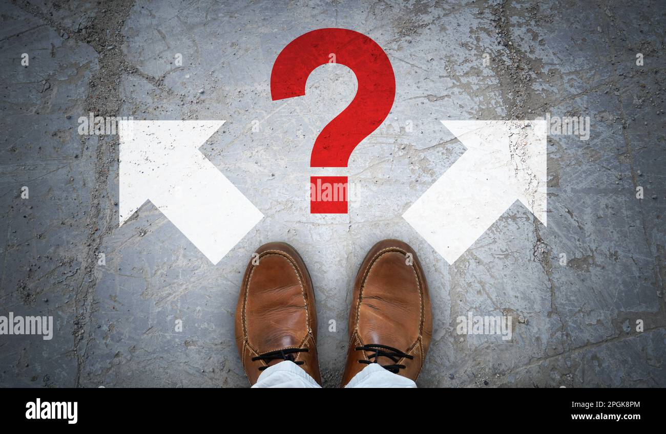 Brown leather shoes, two arrows and question mark - problem concept ...