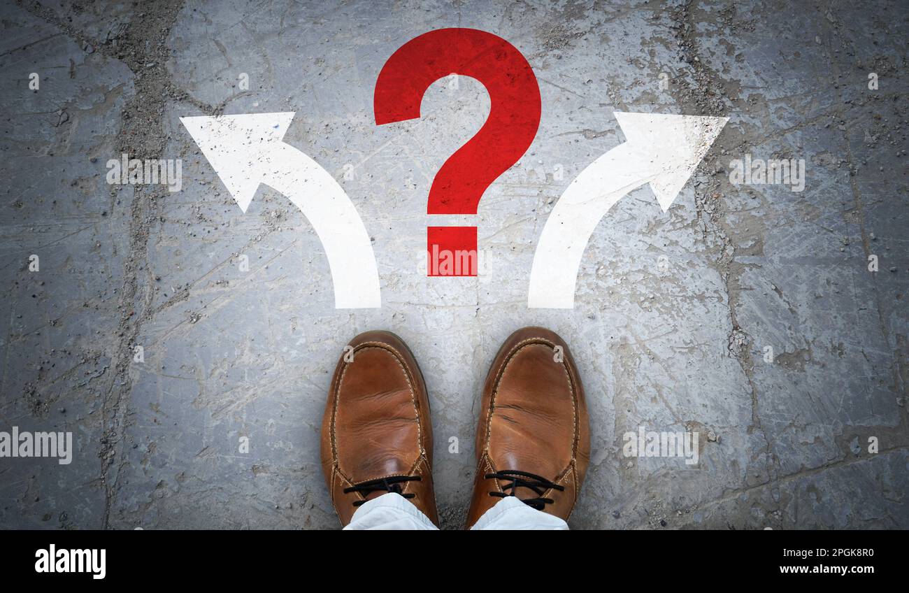 Brown leather shoes, two arrows and question mark - problem concept ...