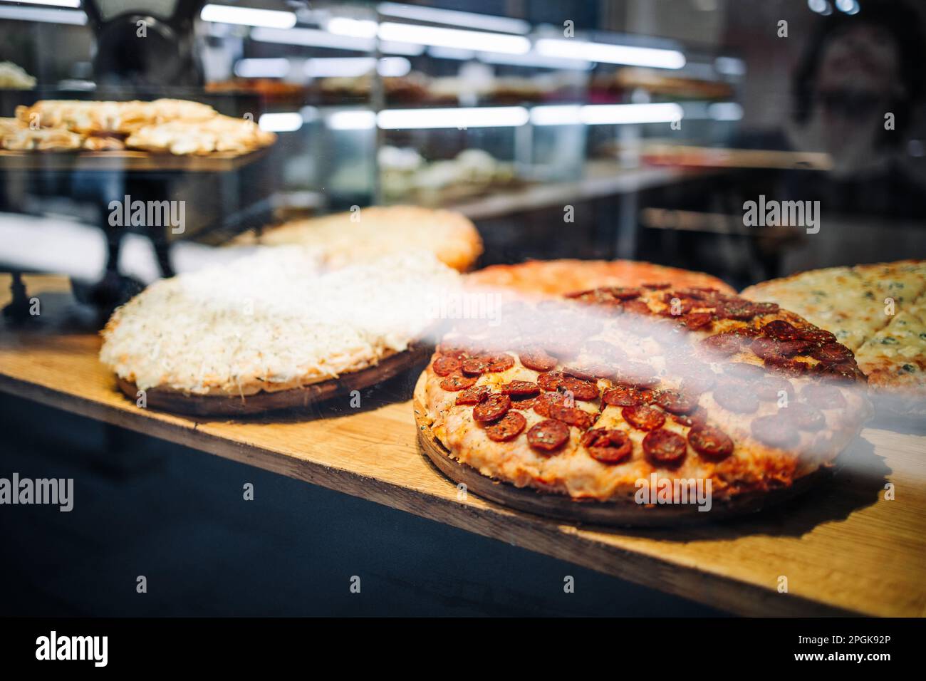 Delicious pizza in the shop window of a small restaurant in Venice ...