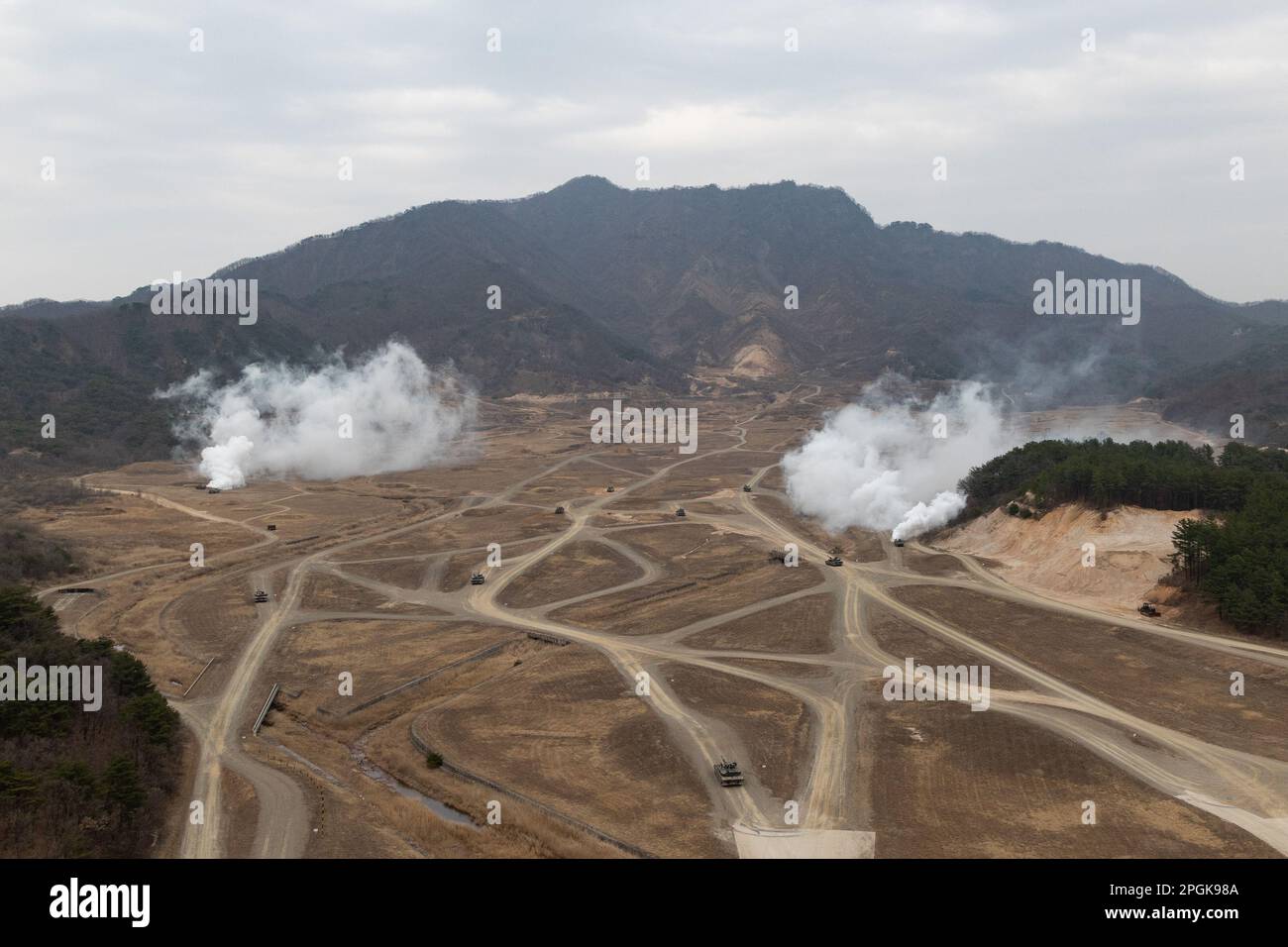 Smoke from U.S. armored vehicles from the 2nd Infantry Division ...
