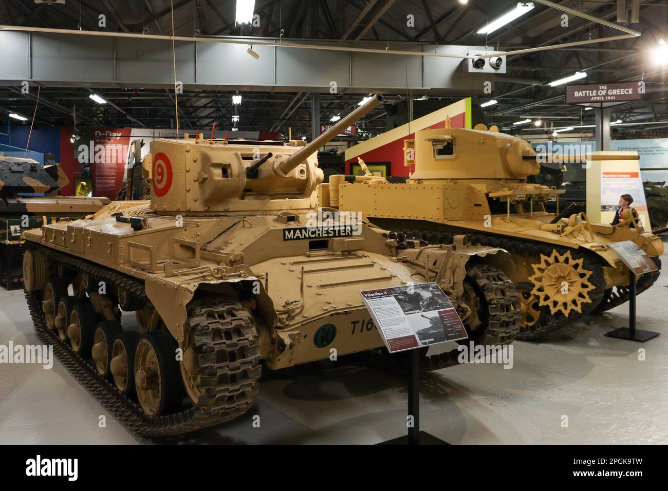 Two massive cylindrical tanks are prominently displayed indoors in a ...