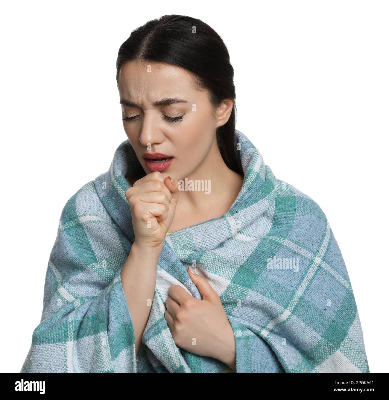 Young woman wrapped in blanket coughing on white background. Cold symptoms Stock Photo - Alamy