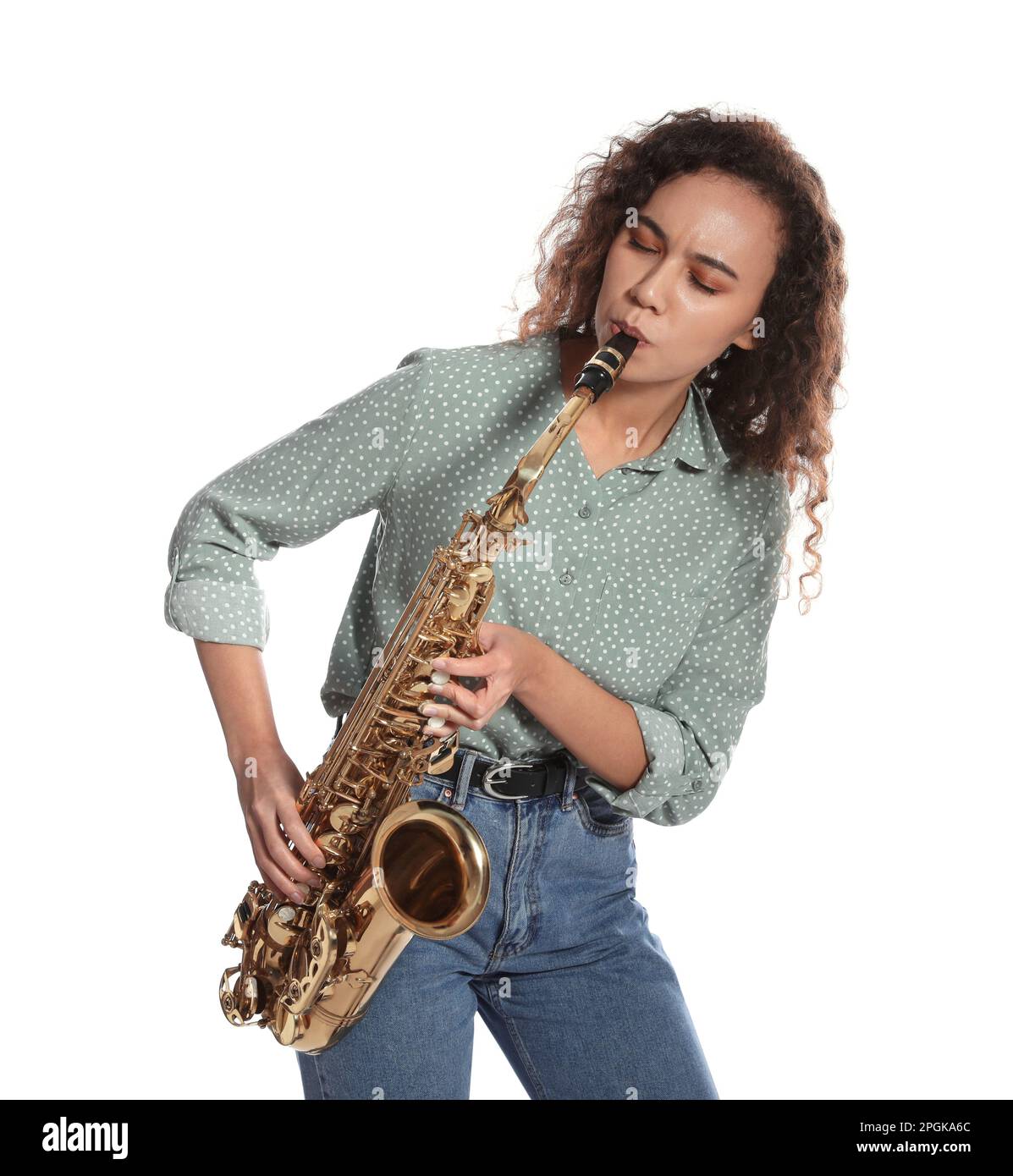 Beautiful African American woman playing saxophone on white background ...