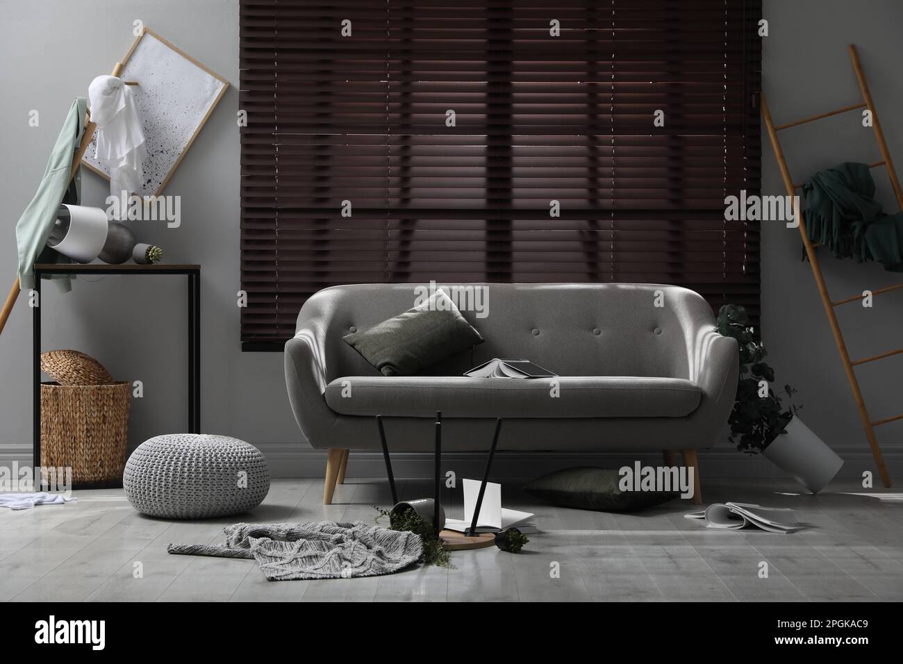 Chaotic living room interior after strong earthquake Stock Photo - Alamy