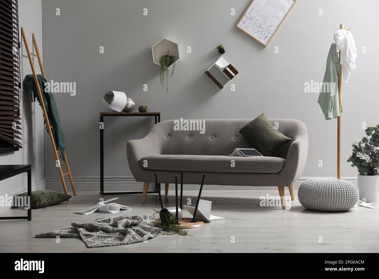 Chaotic living room interior after strong earthquake Stock Photo - Alamy
