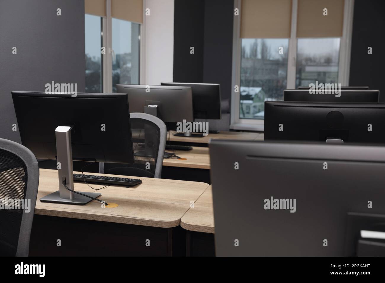 Rows of computers in empty office hi-res stock photography and images ...